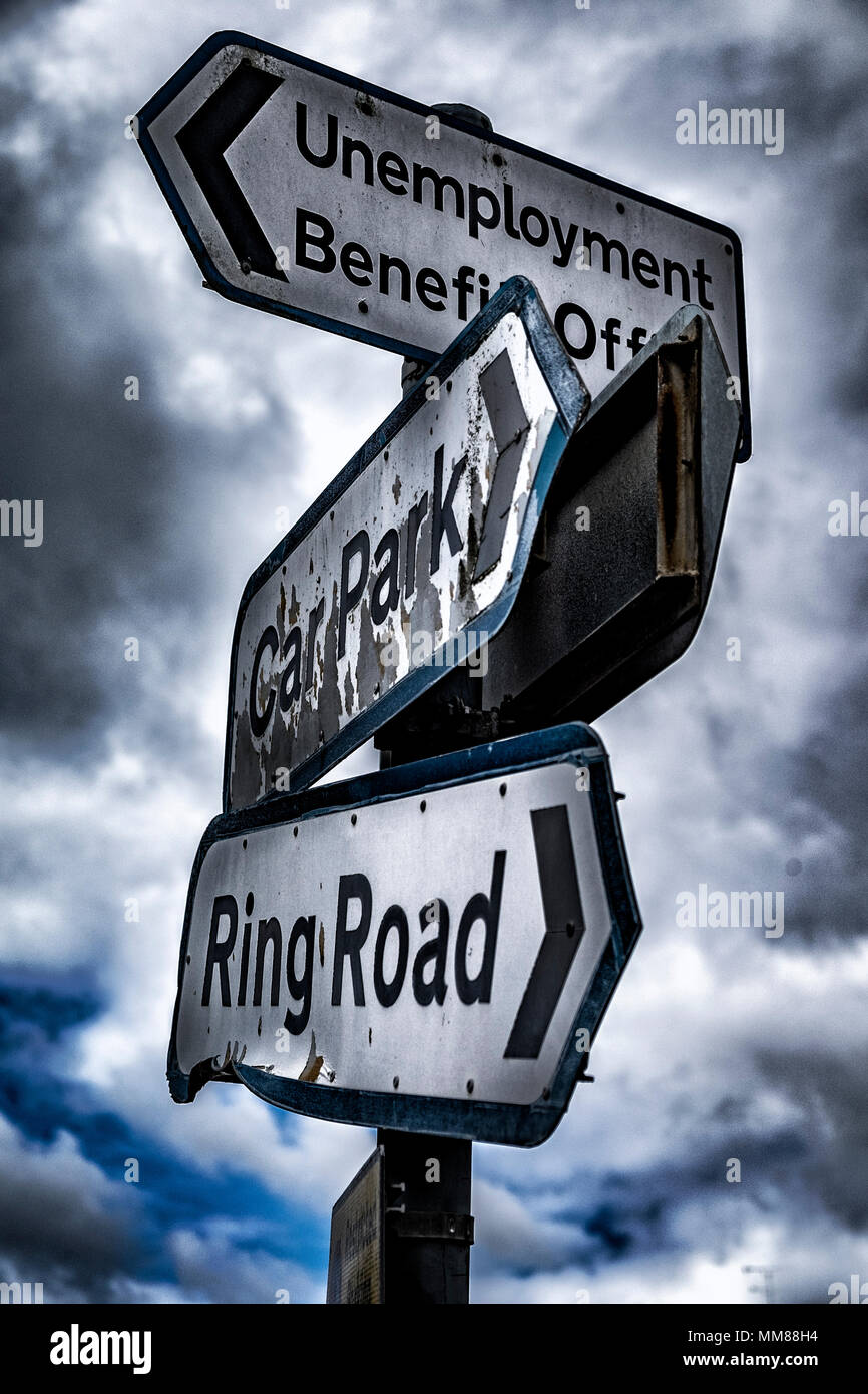 A number of road signs pointing in different directions in Coventry ...