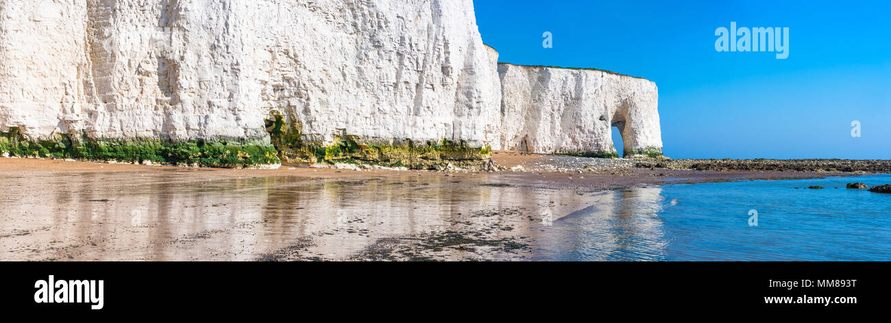 Panoramic view of white chalk cliffs and beach in Kingsgate Bay ...