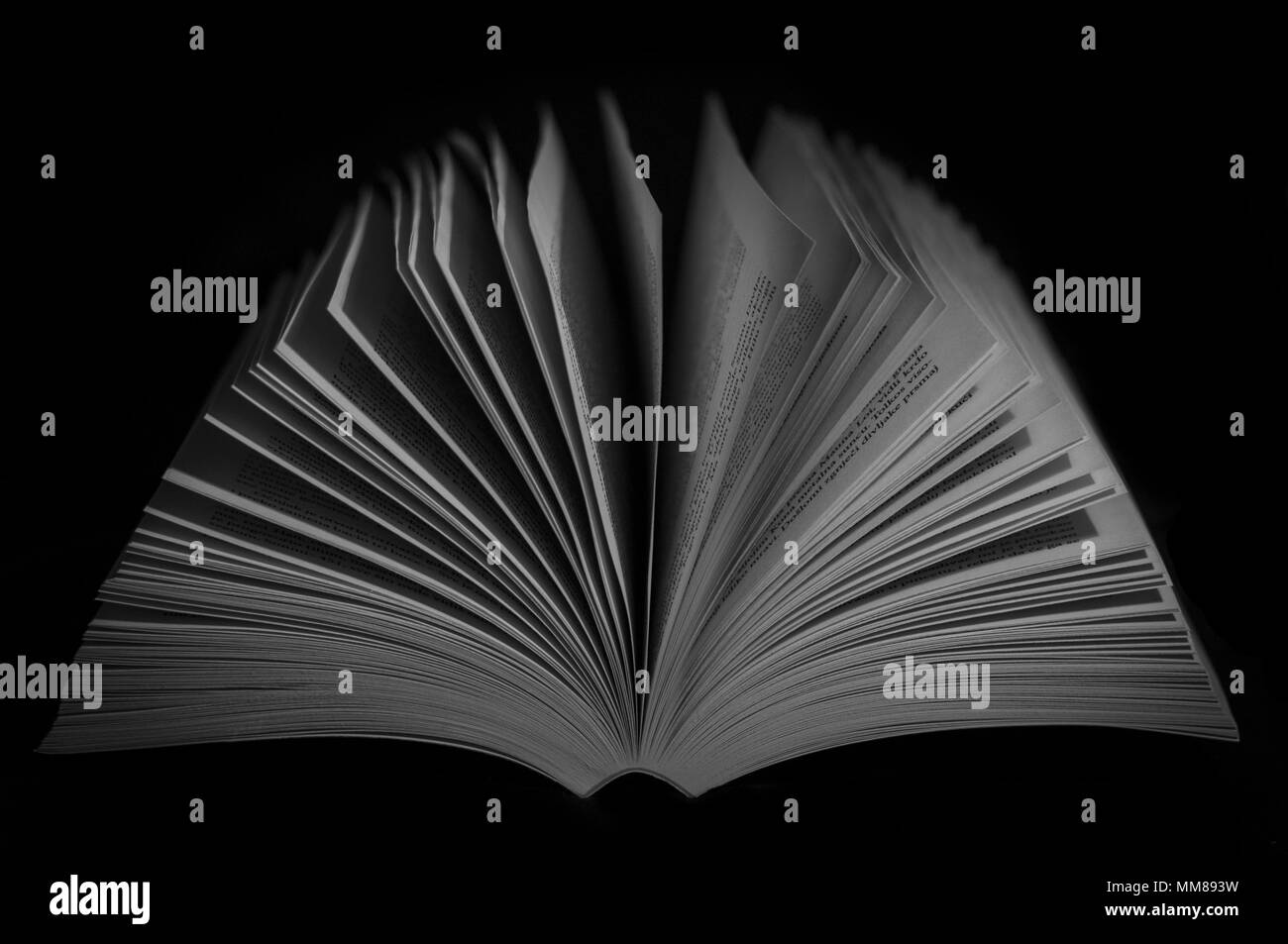 Open book, dark background Stock Photo - Alamy