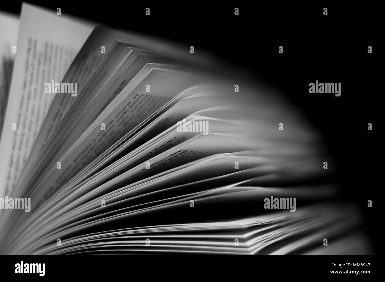 Open book, dark background Stock Photo - Alamy