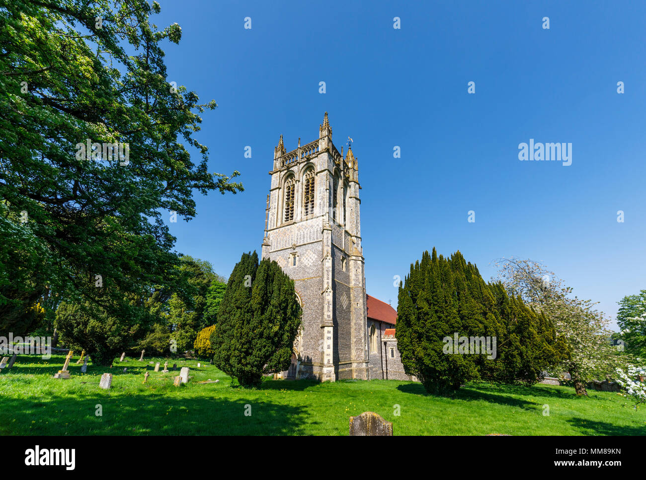 Traditional flint-faced parish church of St John the Evangelist ...