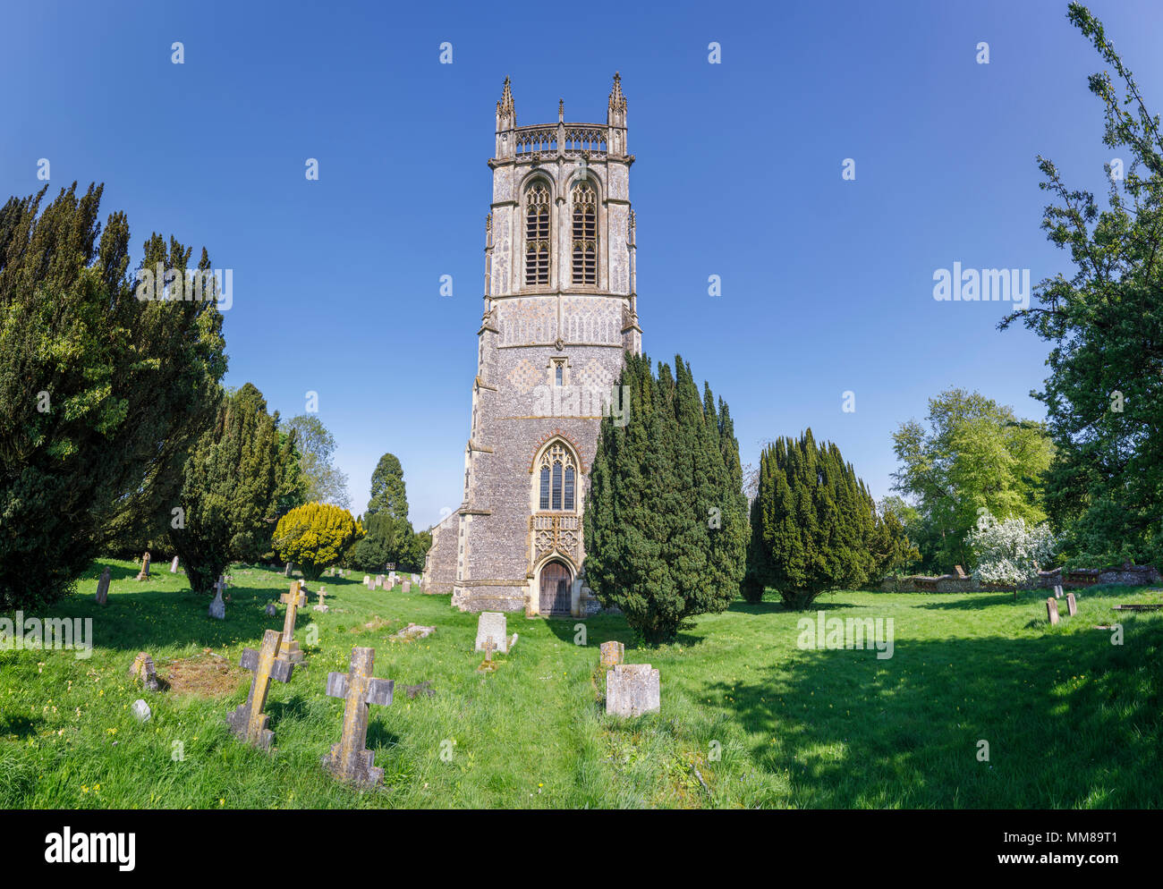 Traditional flint-faced parish church of St John the Evangelist ...