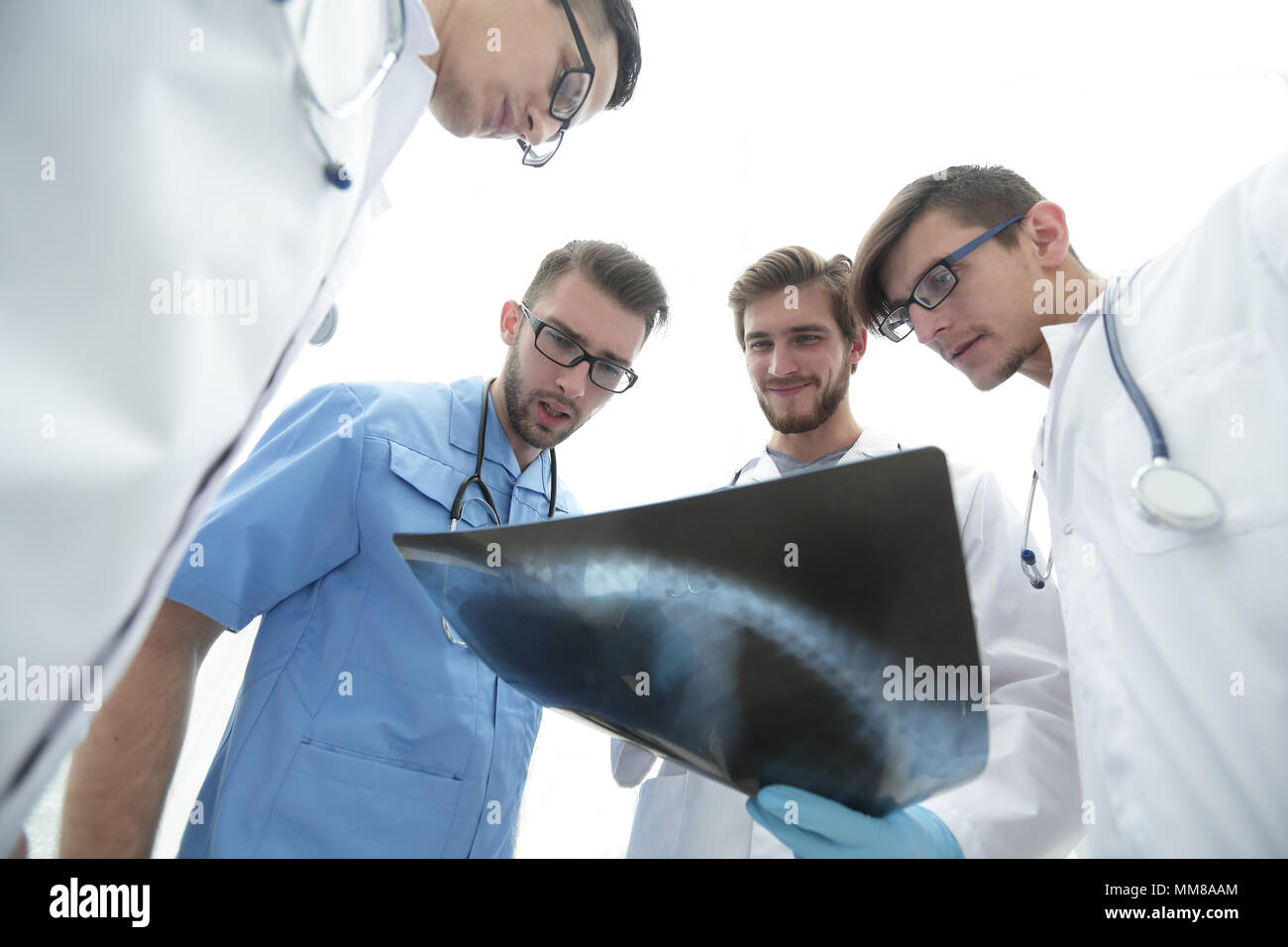 bottom view.team of doctors discussing an x-ray Stock Photo - Alamy