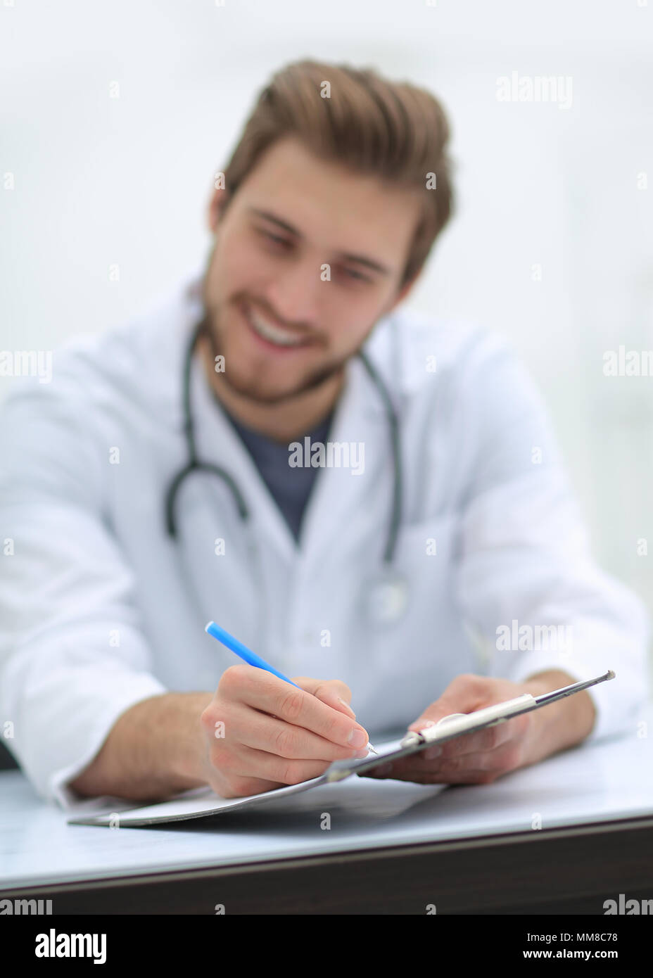 background image of a doctor writing out a prescription Stock Photo - Alamy