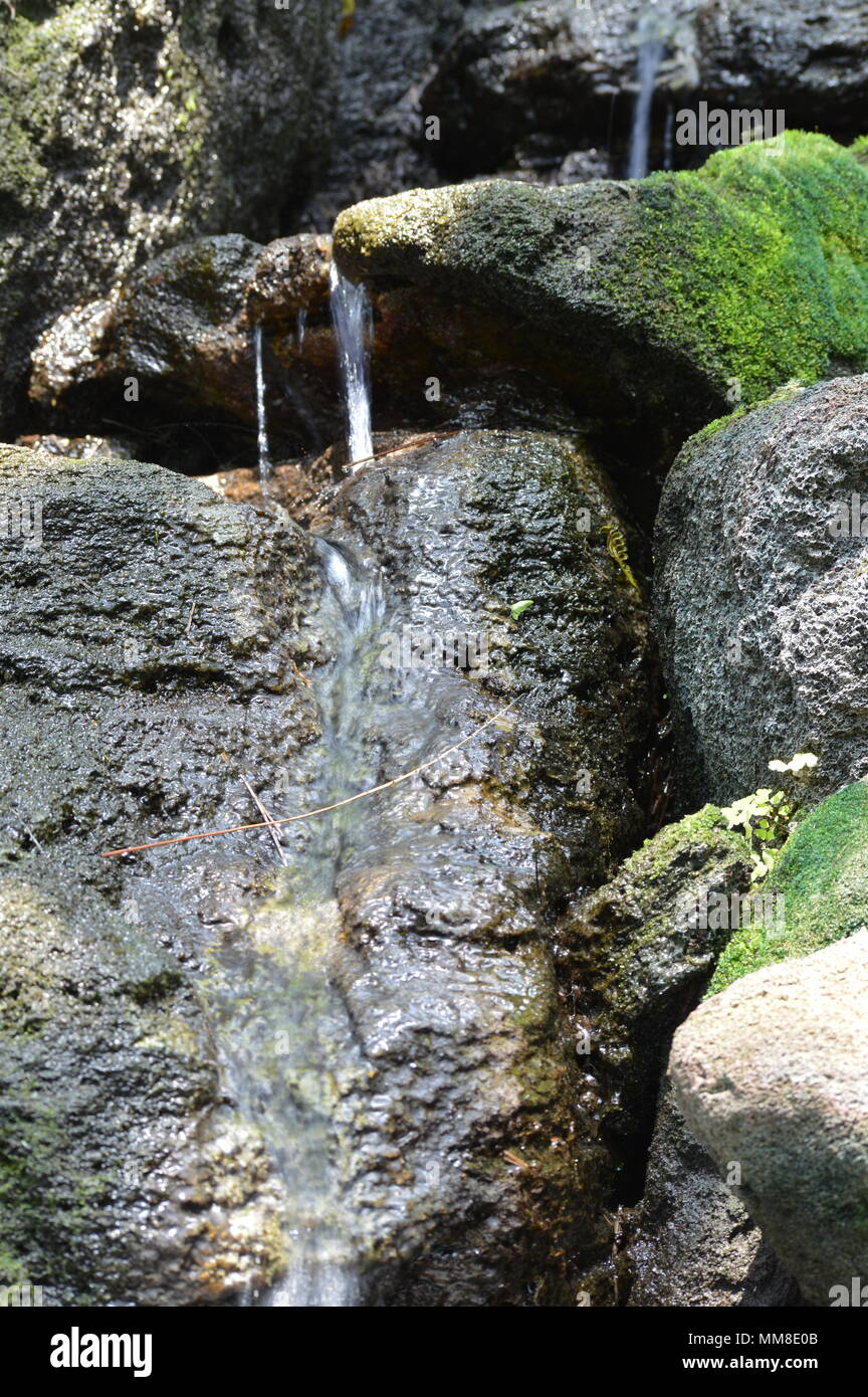 Small waterfall over the rocks Stock Photo - Alamy