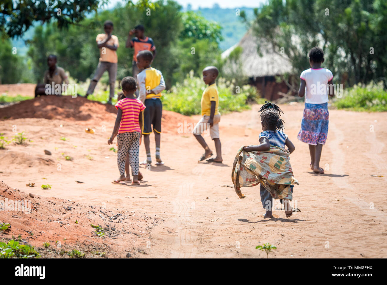 Group of Zambian children run along together, Mukuni Village, Zambia ...