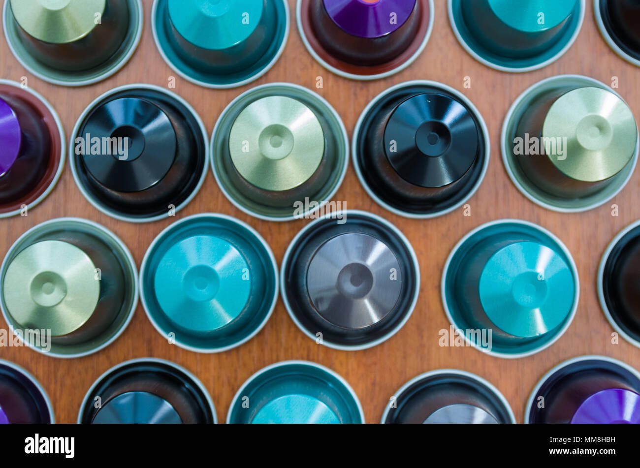 Colored espresso coffee capsules, machine coffee, on wooden background ...