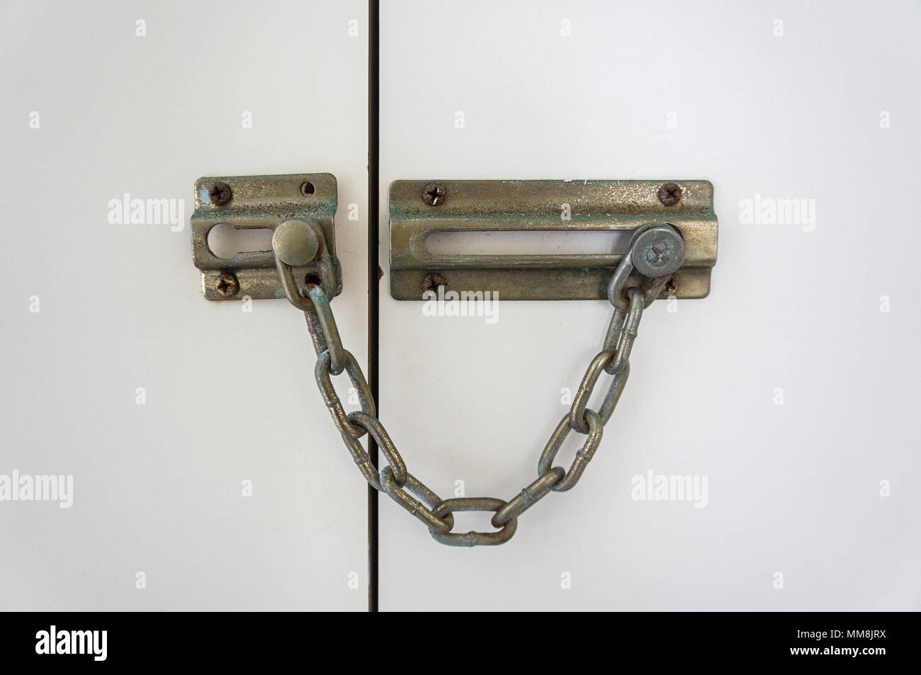door lock latch chain rust steel safety close up Stock Photo - Alamy