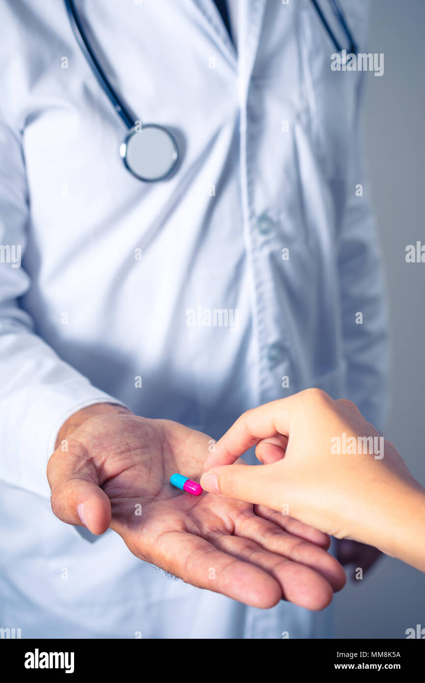 Girl giving person medicine hi-res stock photography and images - Alamy