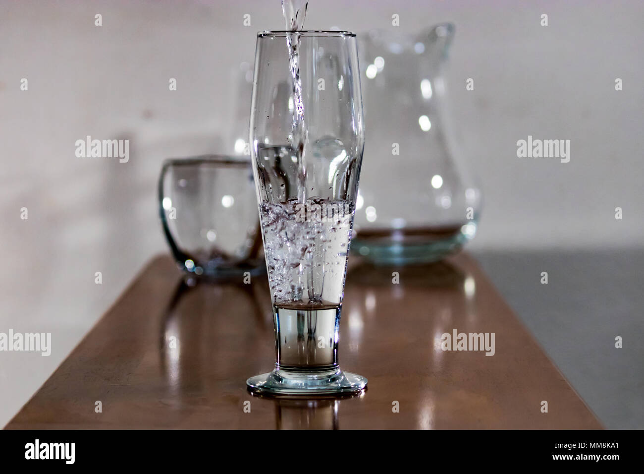 Water pouring tall glass hi-res stock photography and images - Alamy