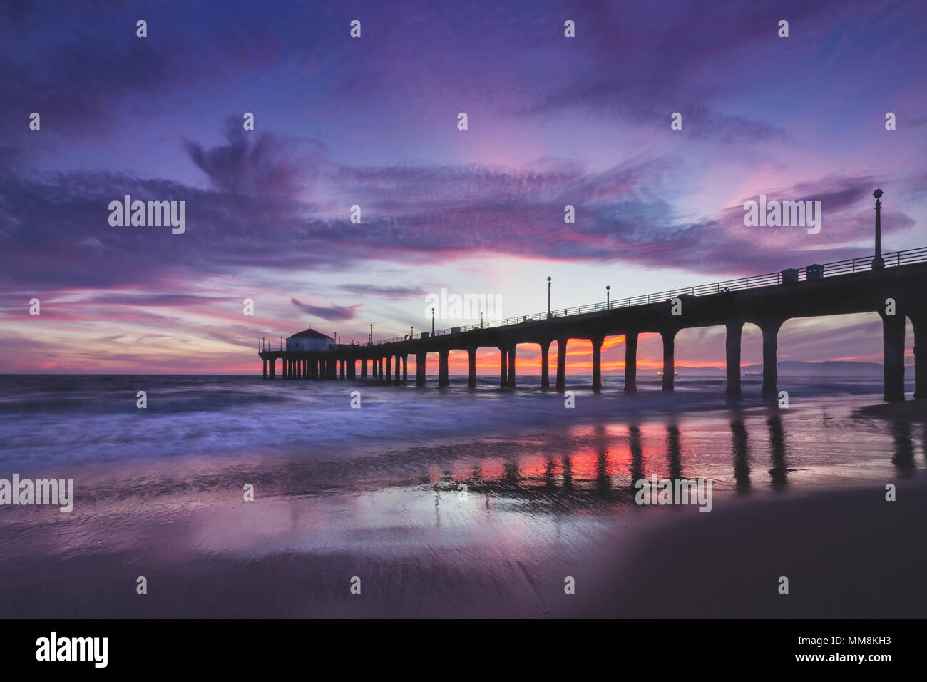 Long-exposure shot of colorful sky and clouds over Manhattan Beach Pier ...