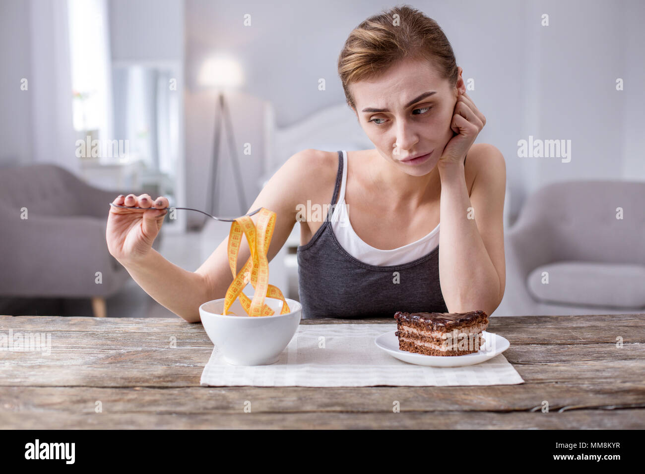 Pleasant young woman feeling bad Stock Photo - Alamy