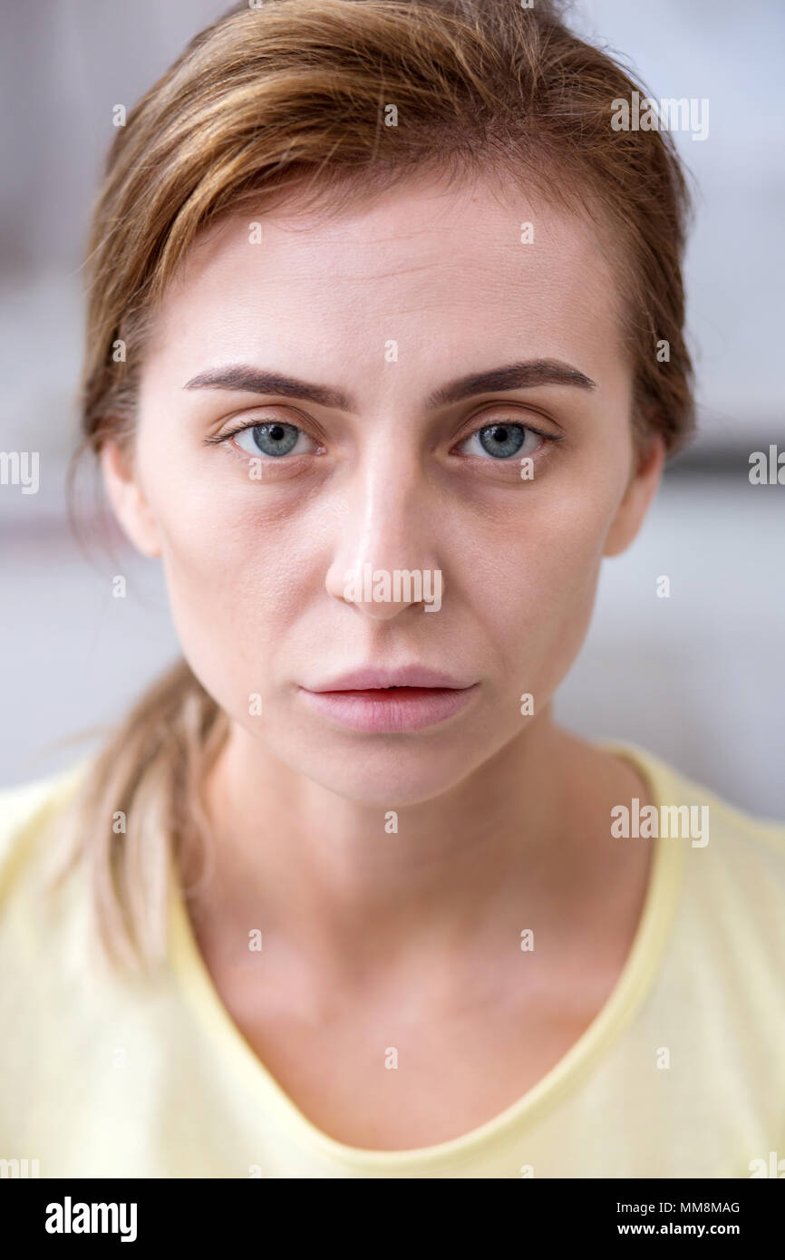 Face of a serious upset woman Stock Photo - Alamy