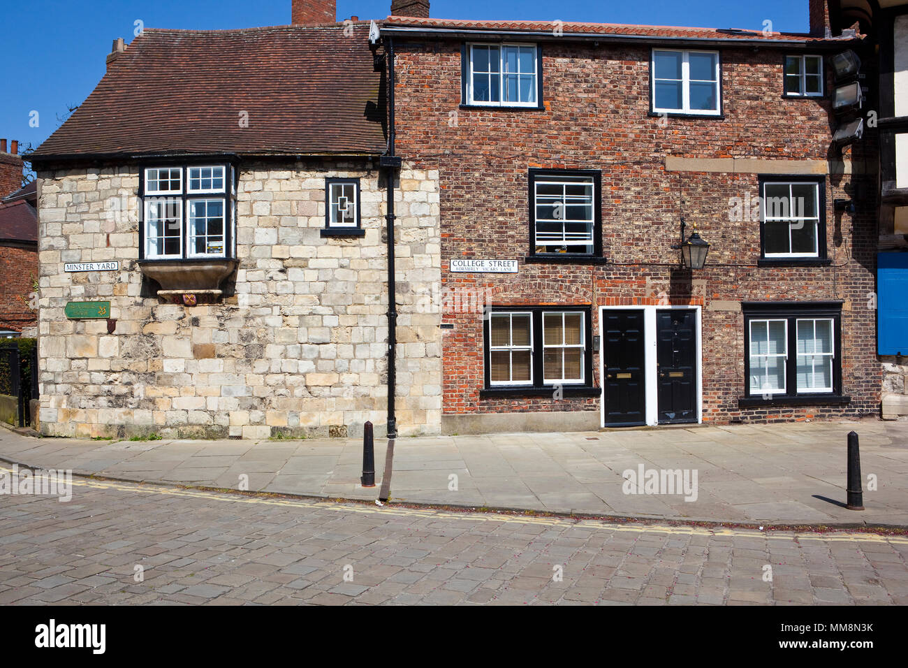 Traditional buildings in stone and brick College street in the historic ...