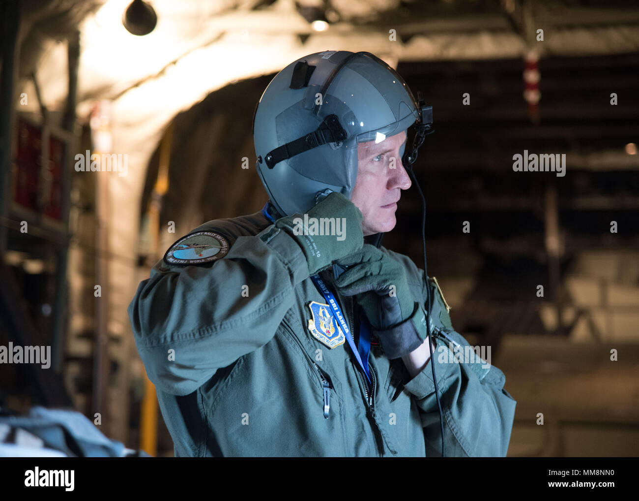 Master Sgt. Douglas Otten, 815th Airlift Squadron loadmaster, assists ...