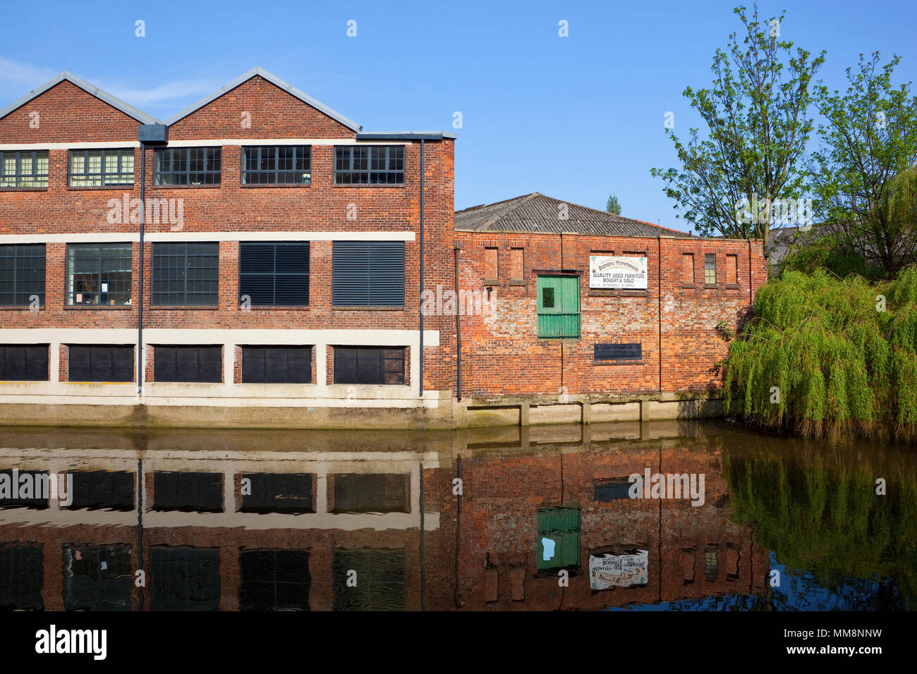 red brick industrial warehouses by the river Foss in the historic city ...
