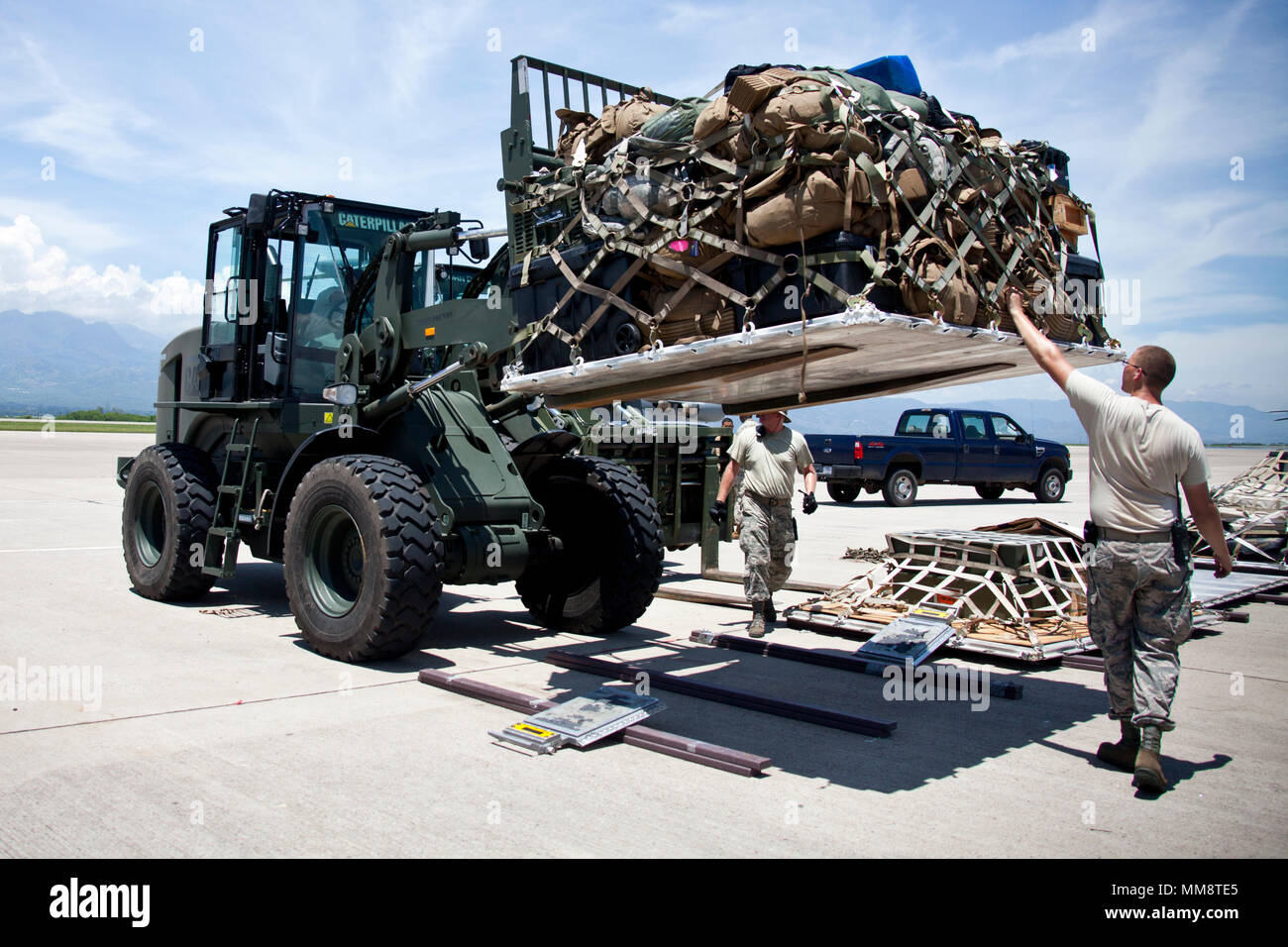 U.S. Airmen with 612th Air Base Squadron, Joint Task Force-Bravo, load ...