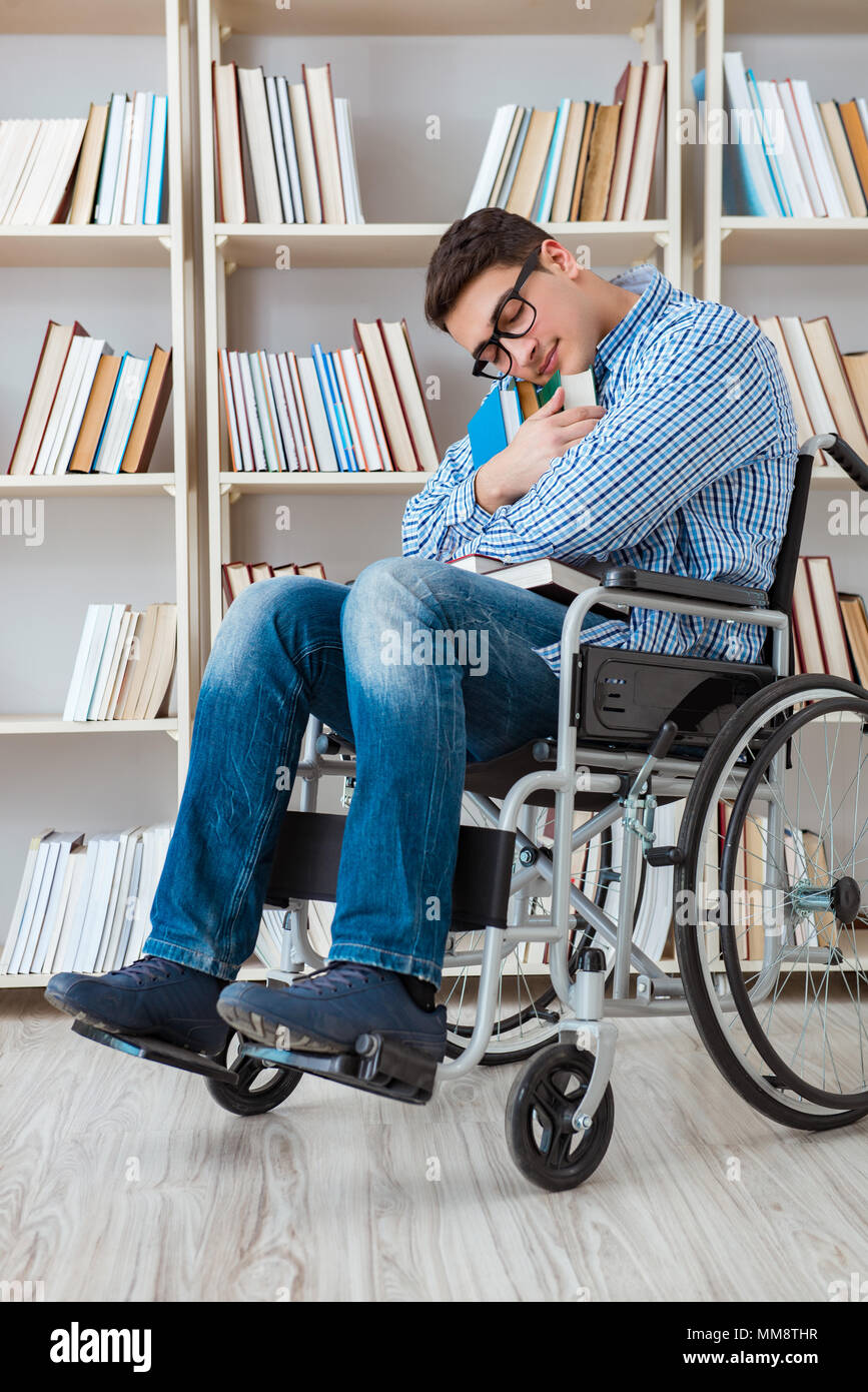 Disabled student studying in the library Stock Photo - Alamy