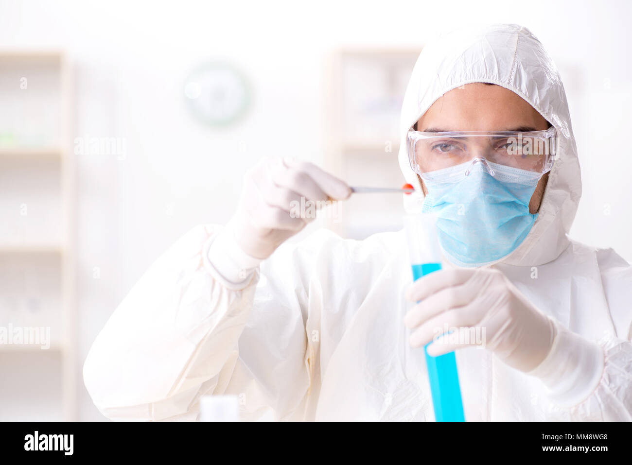 Lab assistant in drug synthesis concept Stock Photo - Alamy