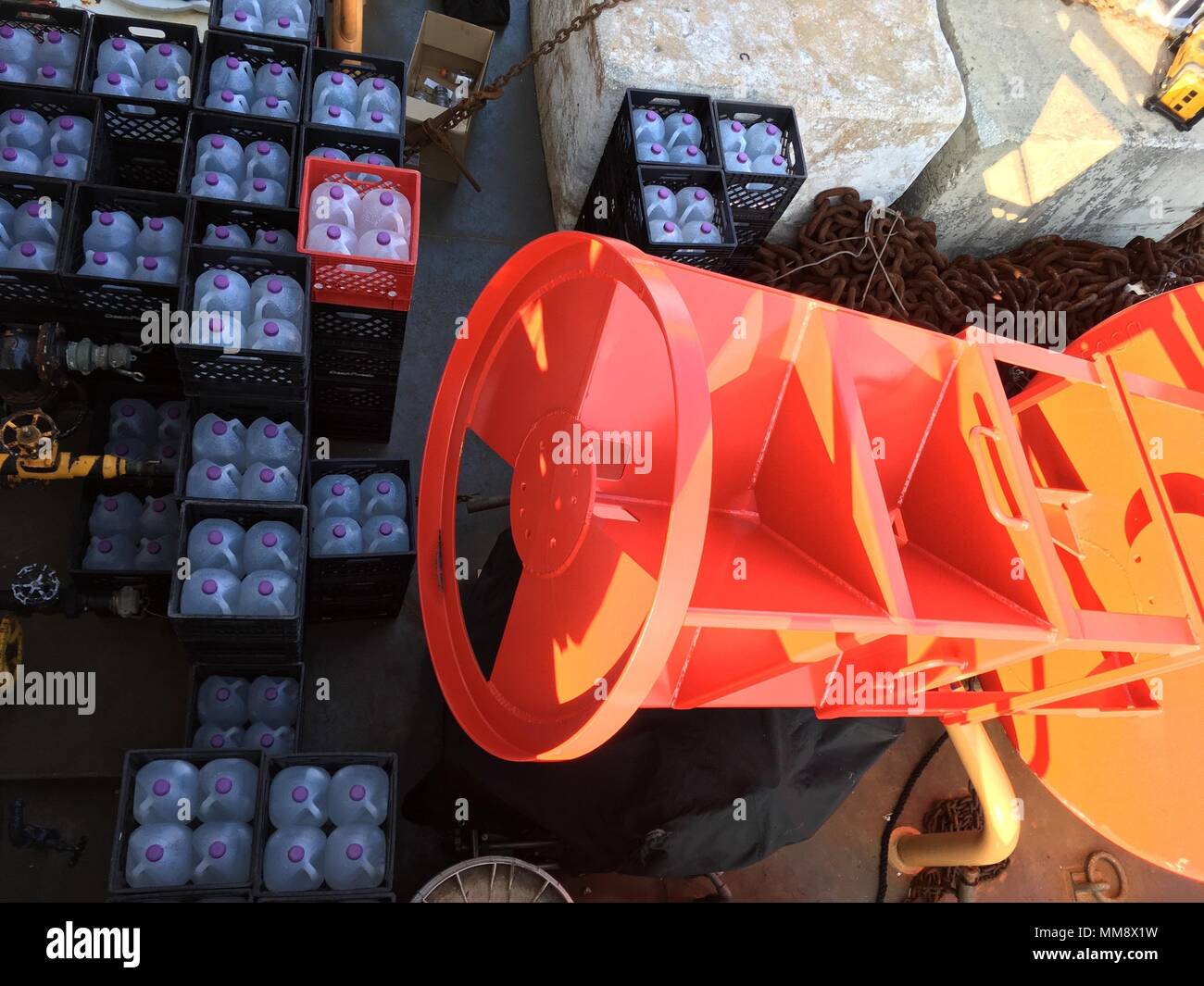 Crates of water sit aboard the Coast Guard Cutter Joshua Appleby, a 175 ...
