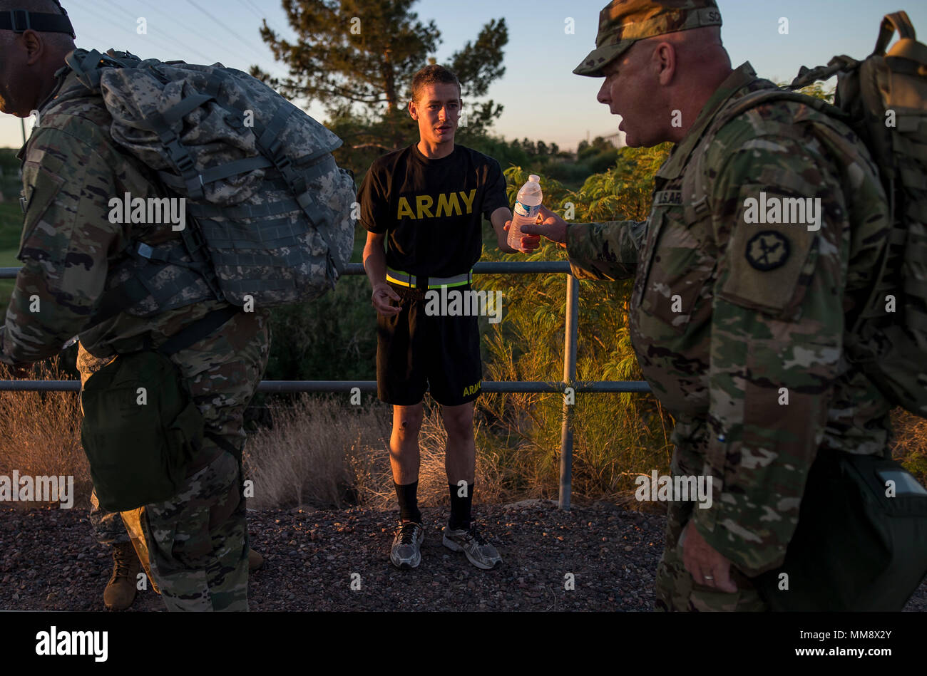 U.S. Army Reserve military police Soldiers hand water bottles to ...