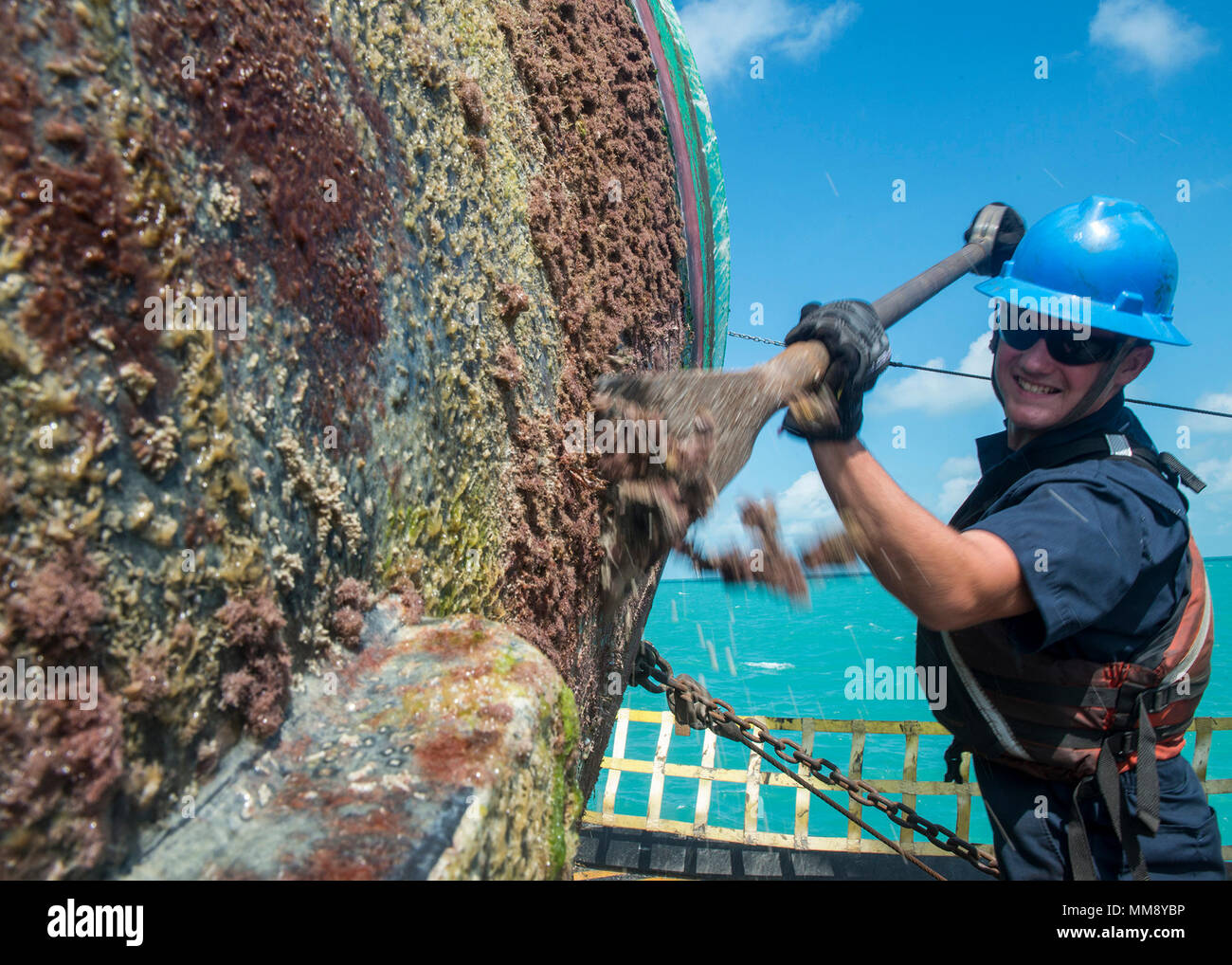 A crewmember from the Coast Guard Cutter Joshua Appleby, a 175-foot ...