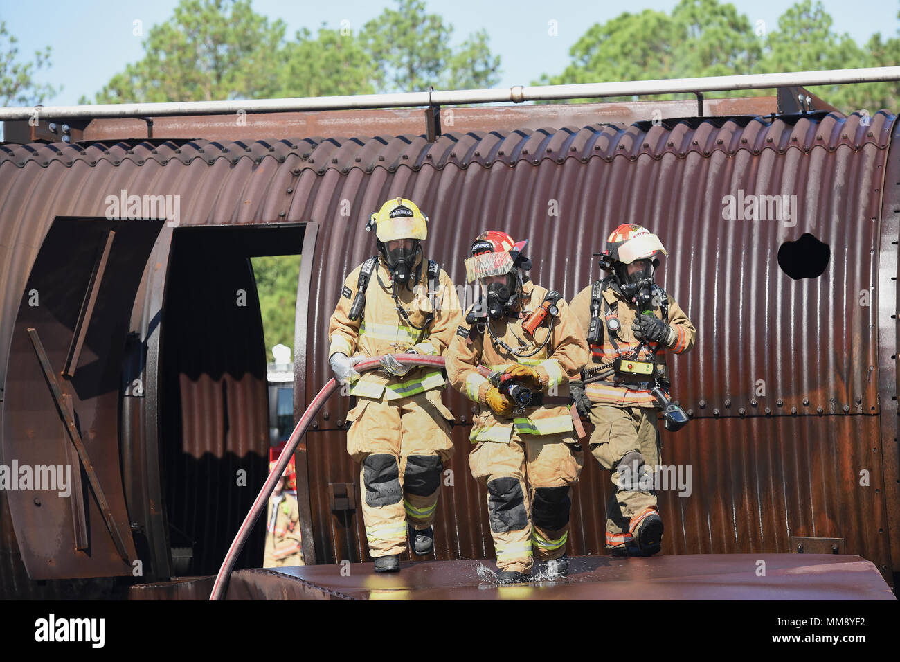 U.S. Air Force firefighters, assigned to the 169th Civil Engineer ...