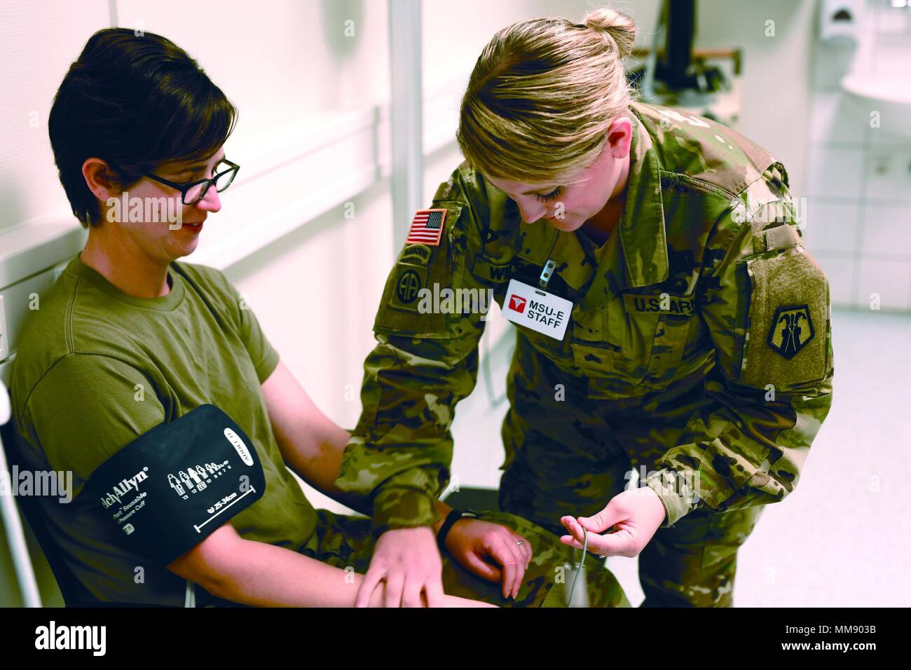 Sgt. Lauren Weatherspoon has her blood pressure taken by Sgt. Jennifer ...
