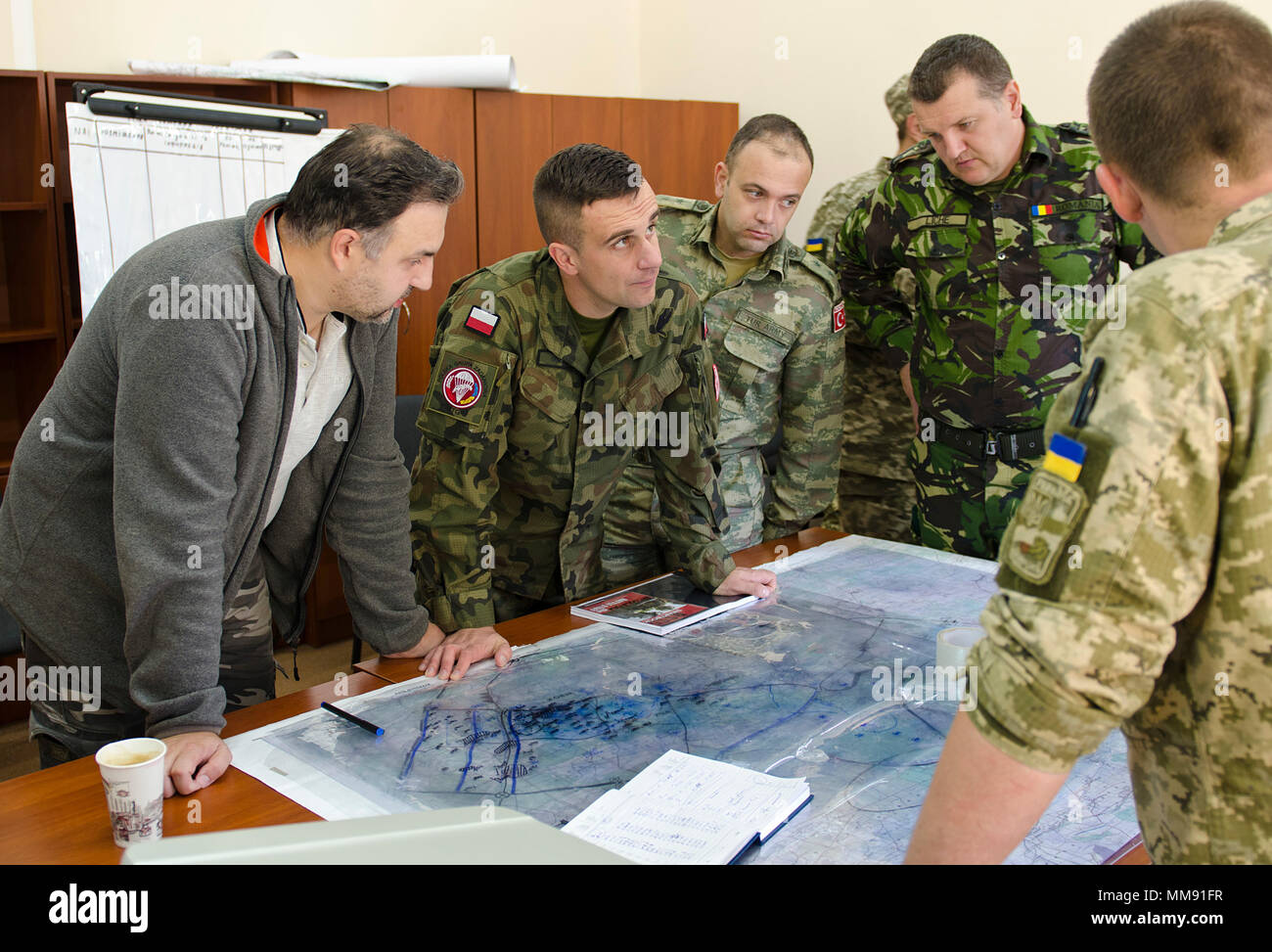 Turkish, Polish, Romanian and Ukrainian soldiers discuss movement ...