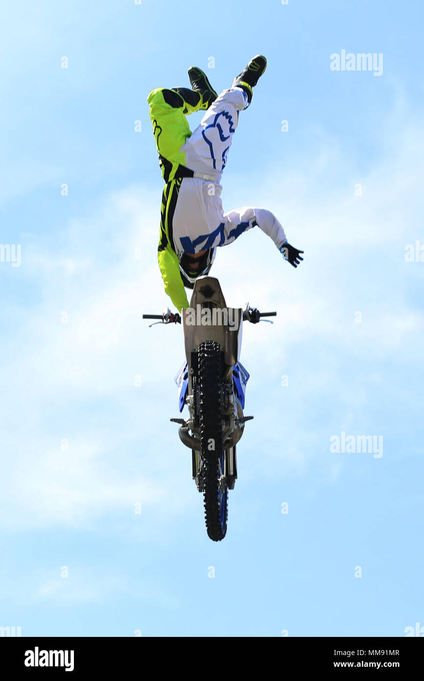Derek Burlew, a professional freestyle motocross rider, performs a ...