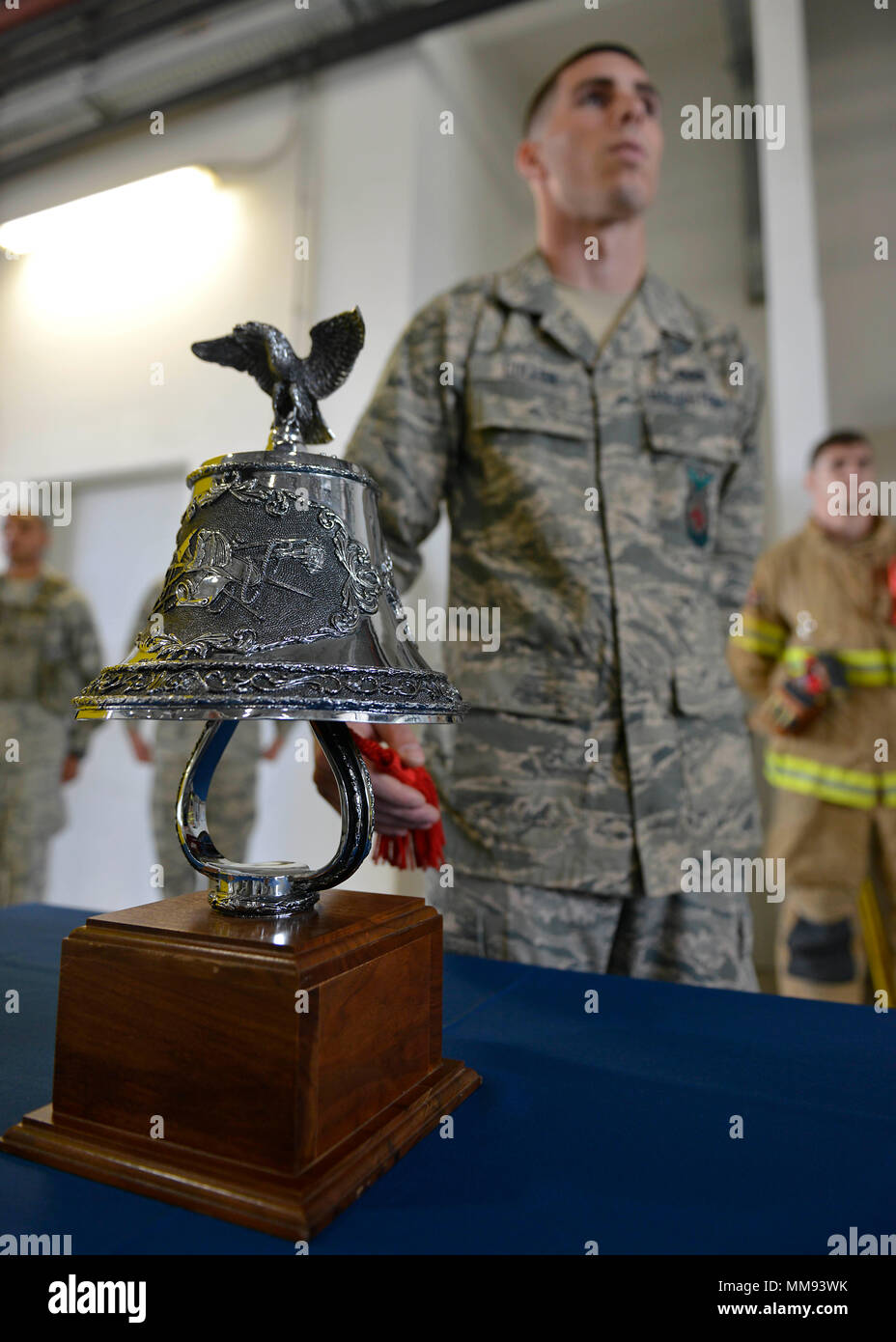 A bell is rung during a 9/11 remembrance ceremony at Aviano Air Base ...
