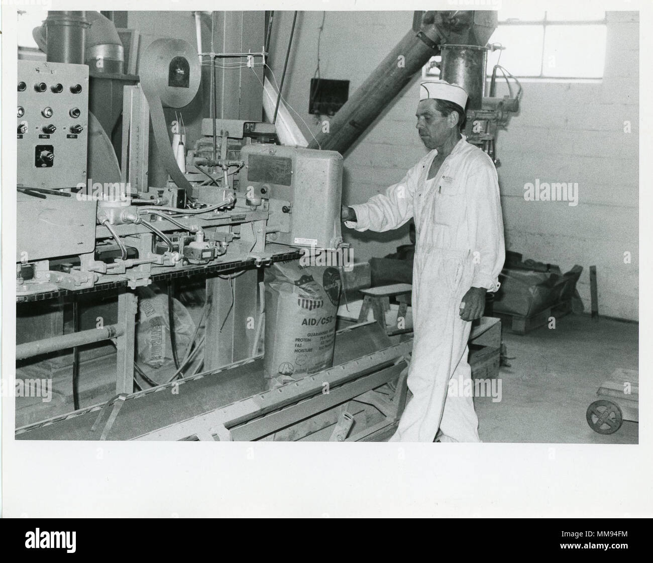 Snapshot of a man working in a factory Stock Photo - Alamy