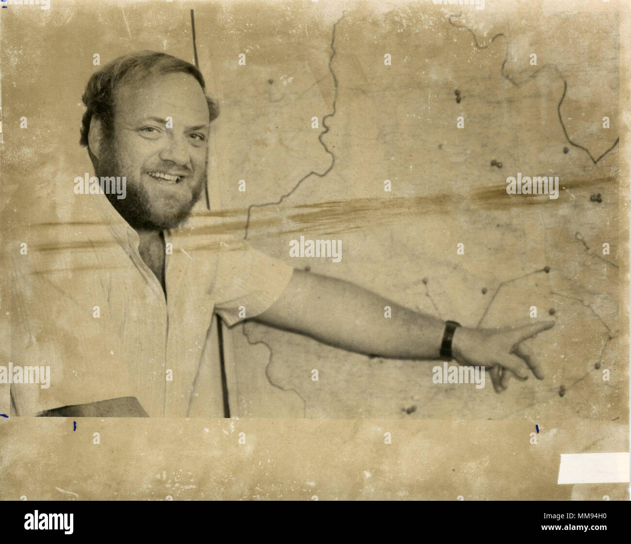 Snapshot of a man, pointing to a place on the map Stock Photo - Alamy