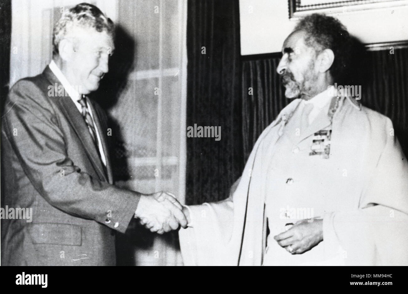 Old photo of two men shaking hands Stock Photo - Alamy