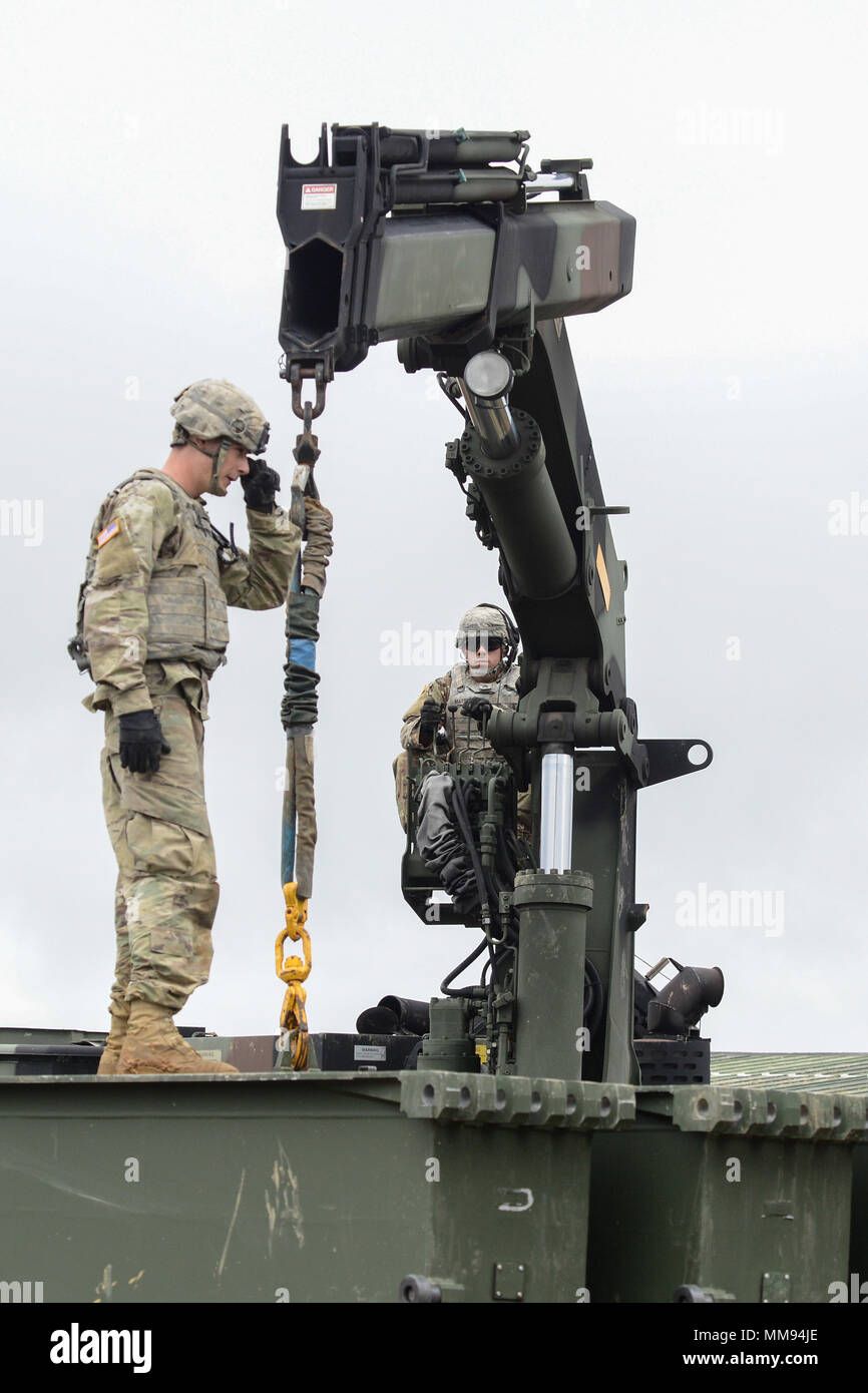 Members of the 19th Engineers Battalion assemble and set a land bridge ...