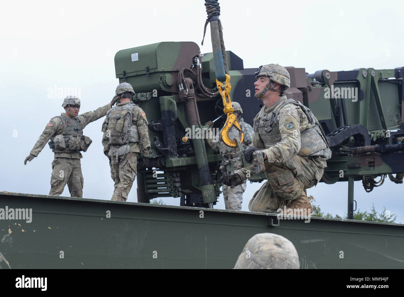 Members of the 19th Engineers Battalion assemble and set a land bridge ...