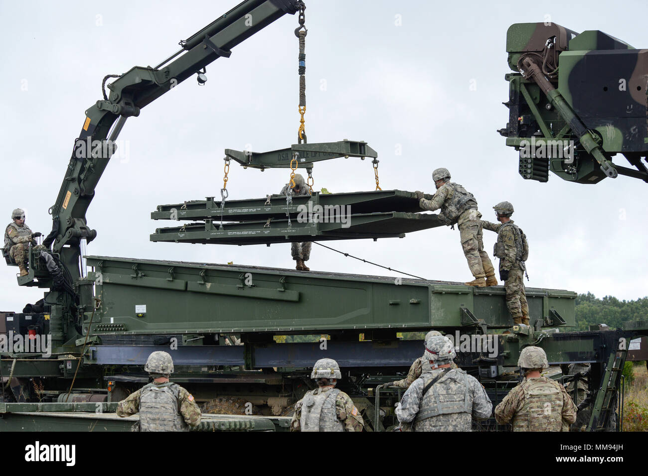 Members of the 19th Engineers Battalion assemble and set a land bridge ...