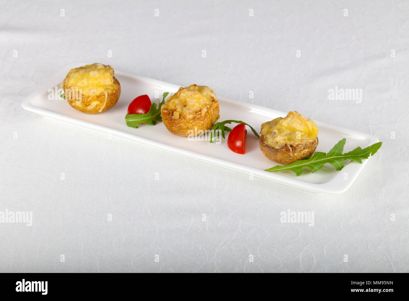 Baked mushrooms champignon with cheese Stock Photo - Alamy