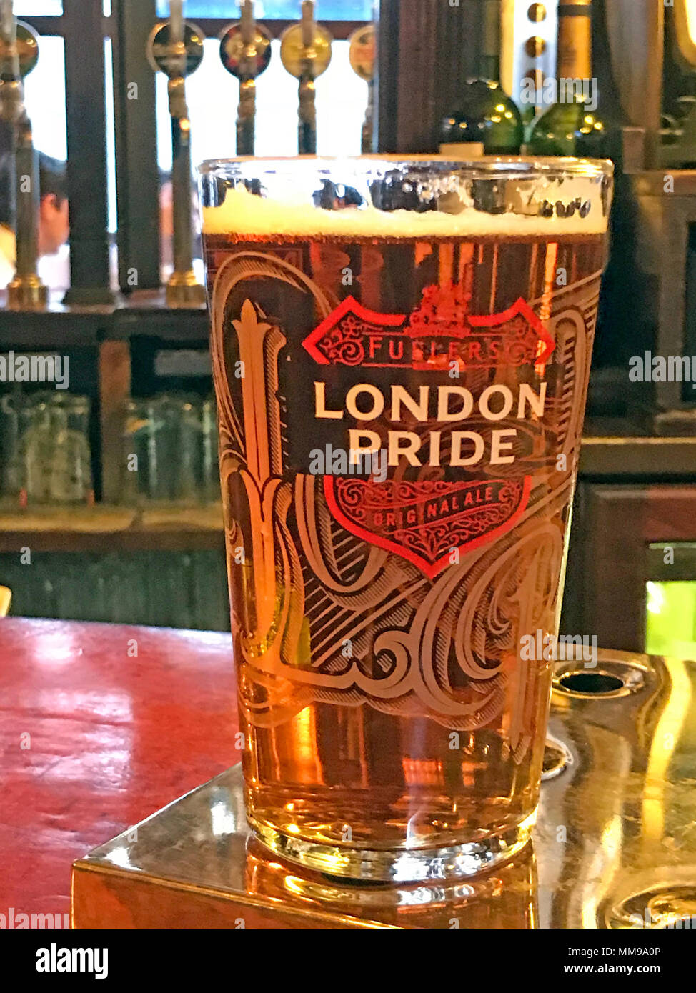Pint of London Pride, on a bar in the City of London, England, UK Stock ...
