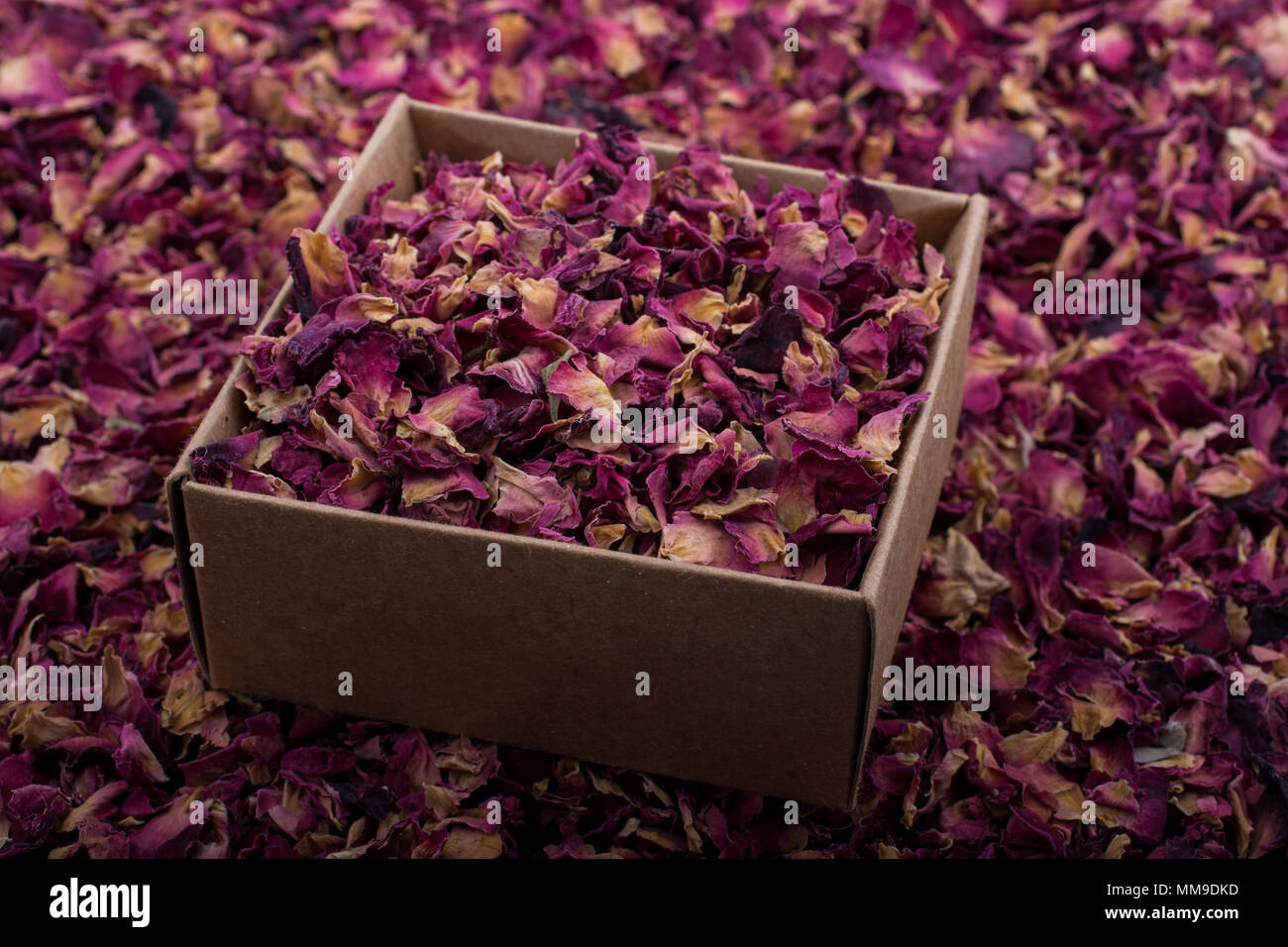 Dried rose petals in box and as a background Stock Photo - Alamy