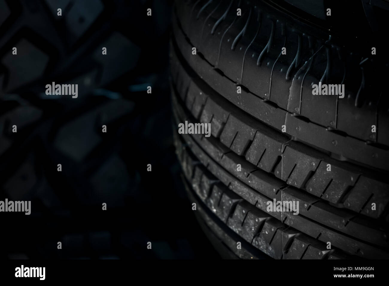 Close up car tires isolated on black background Stock Photo - Alamy