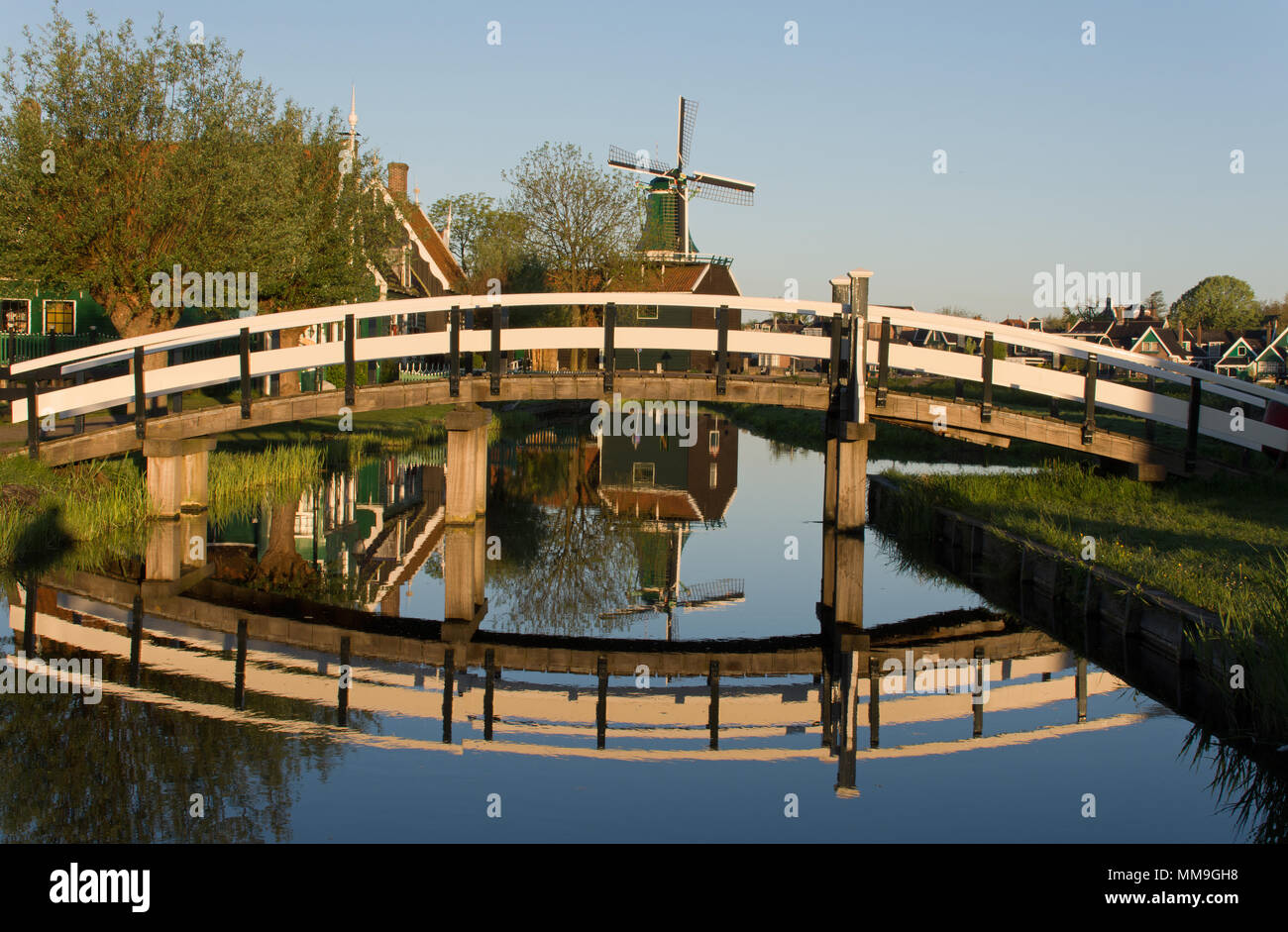 Arch bridge and windmill in Zaanse Schans, The Netherlands Stock Photo ...