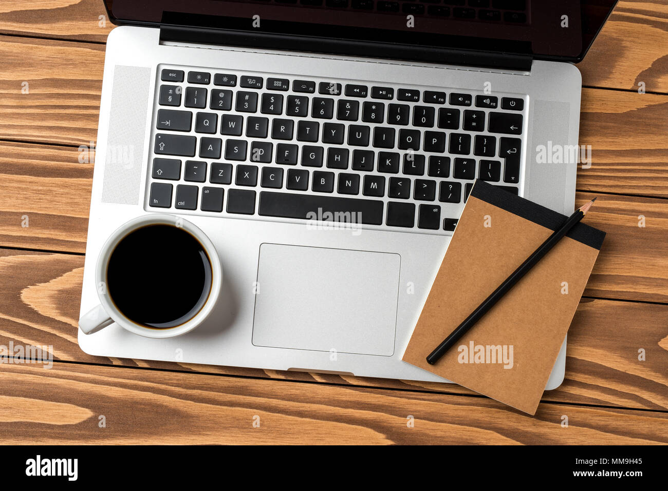Modern laptop on wooden table. Close up Stock Photo - Alamy