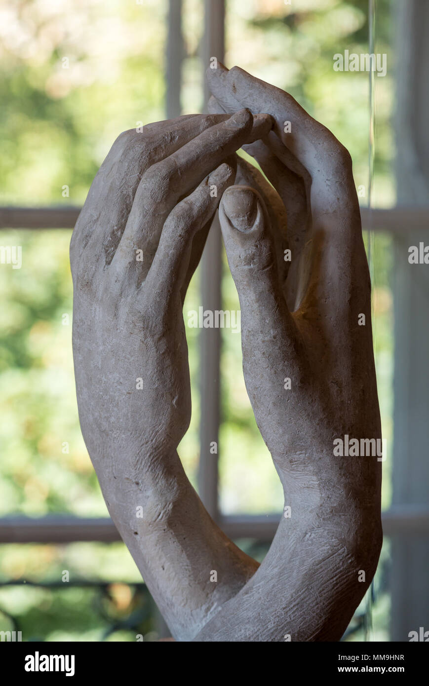 Paris - Museum Rodin. Sculpture of the Cathedral is a combination of ...