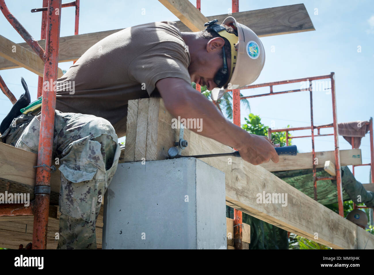 Builder 3rd Class Mathew Tinsley, assigned to Naval Mobile Construction ...