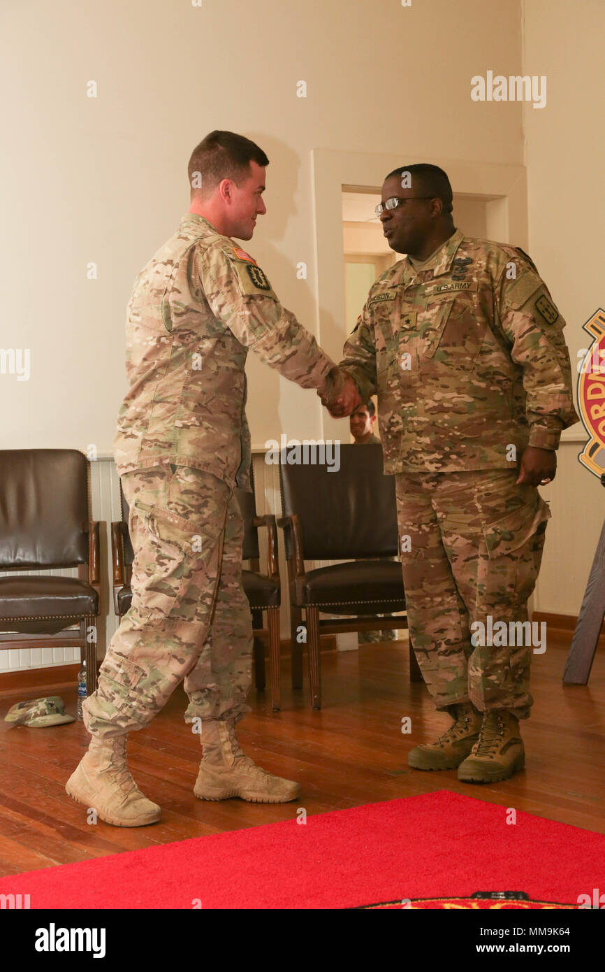 U.S. Soldiers shakes hands with Brig. Gen. David Wilson, the 40th Chief ...