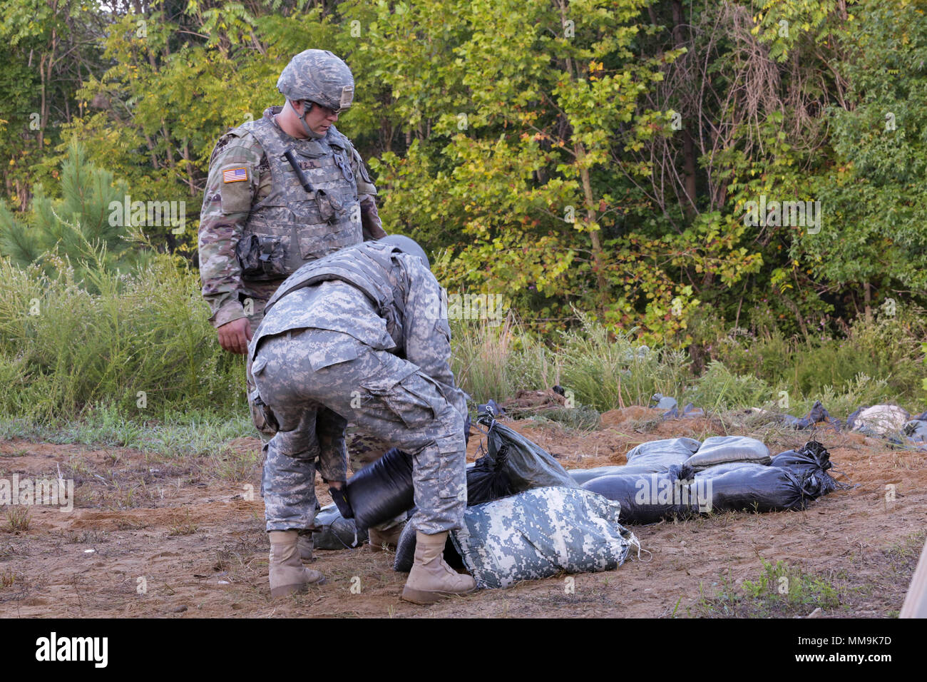 U.S. Army Staff Sgt. Evan Putman and Spc. Michael Wing, a Explosive ...