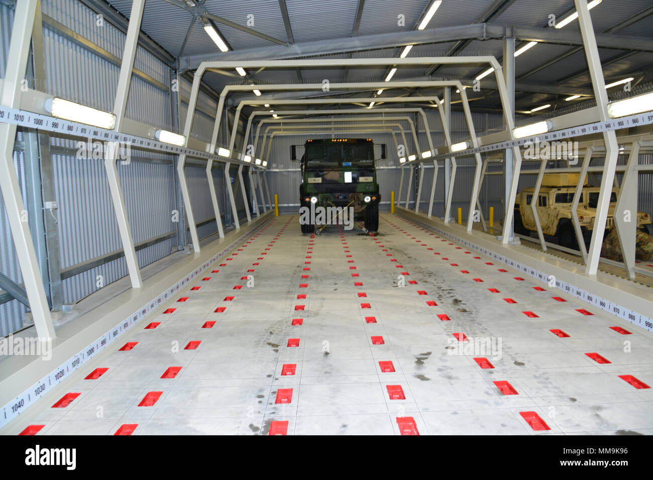 A M1078 LMTV light utility truck is loaded into a C-17 Aircraft Static ...