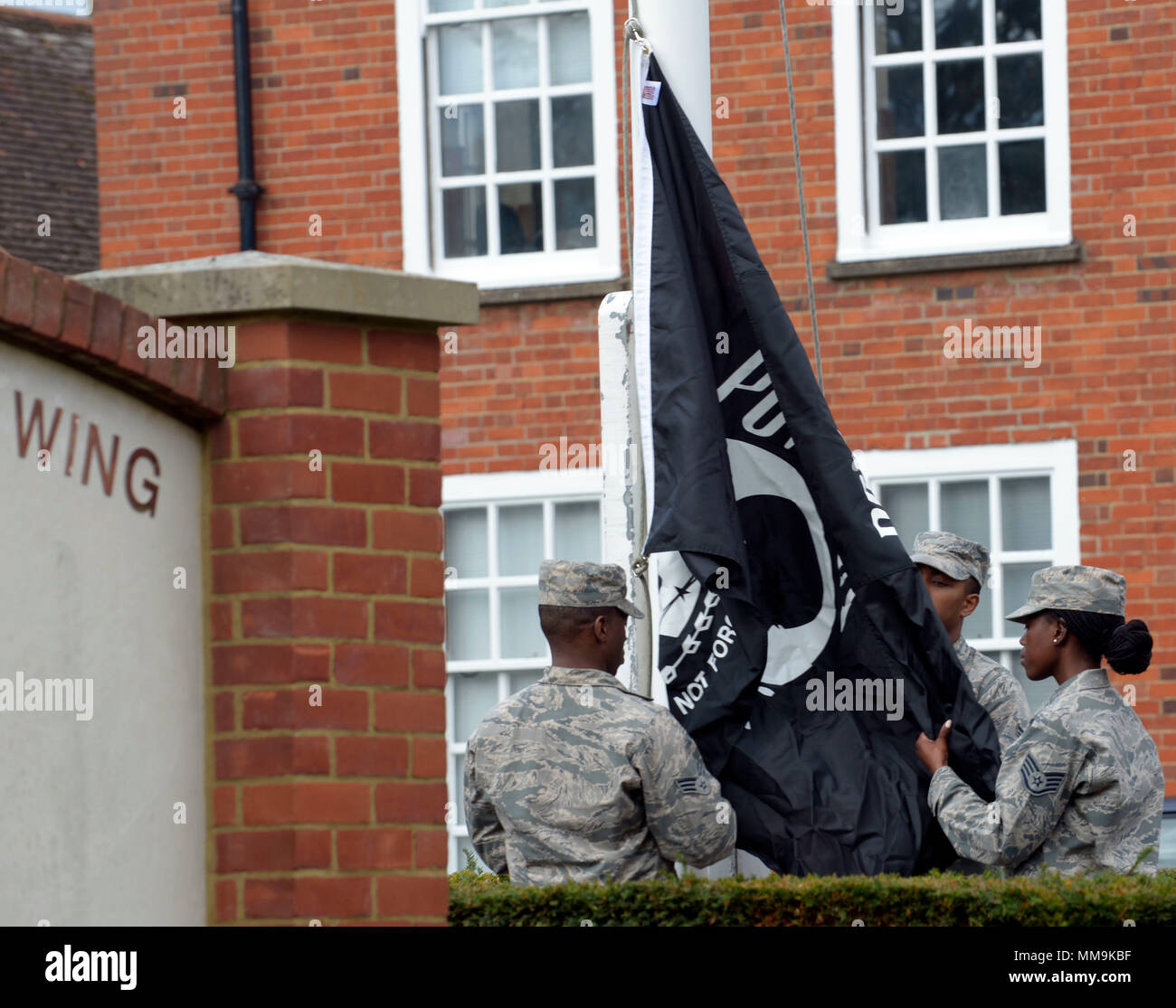 U.S. Air Force Airmen from the 100th Air Refueling Wing raise the POW ...