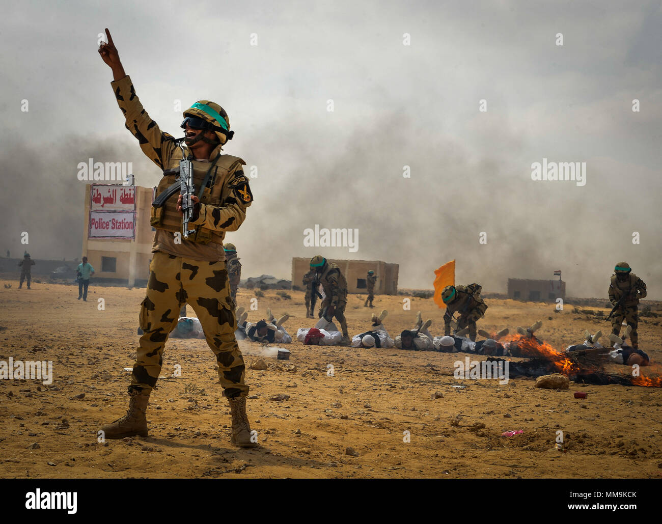 An Egyptian Special Forces commando signals for reinforcements during ...